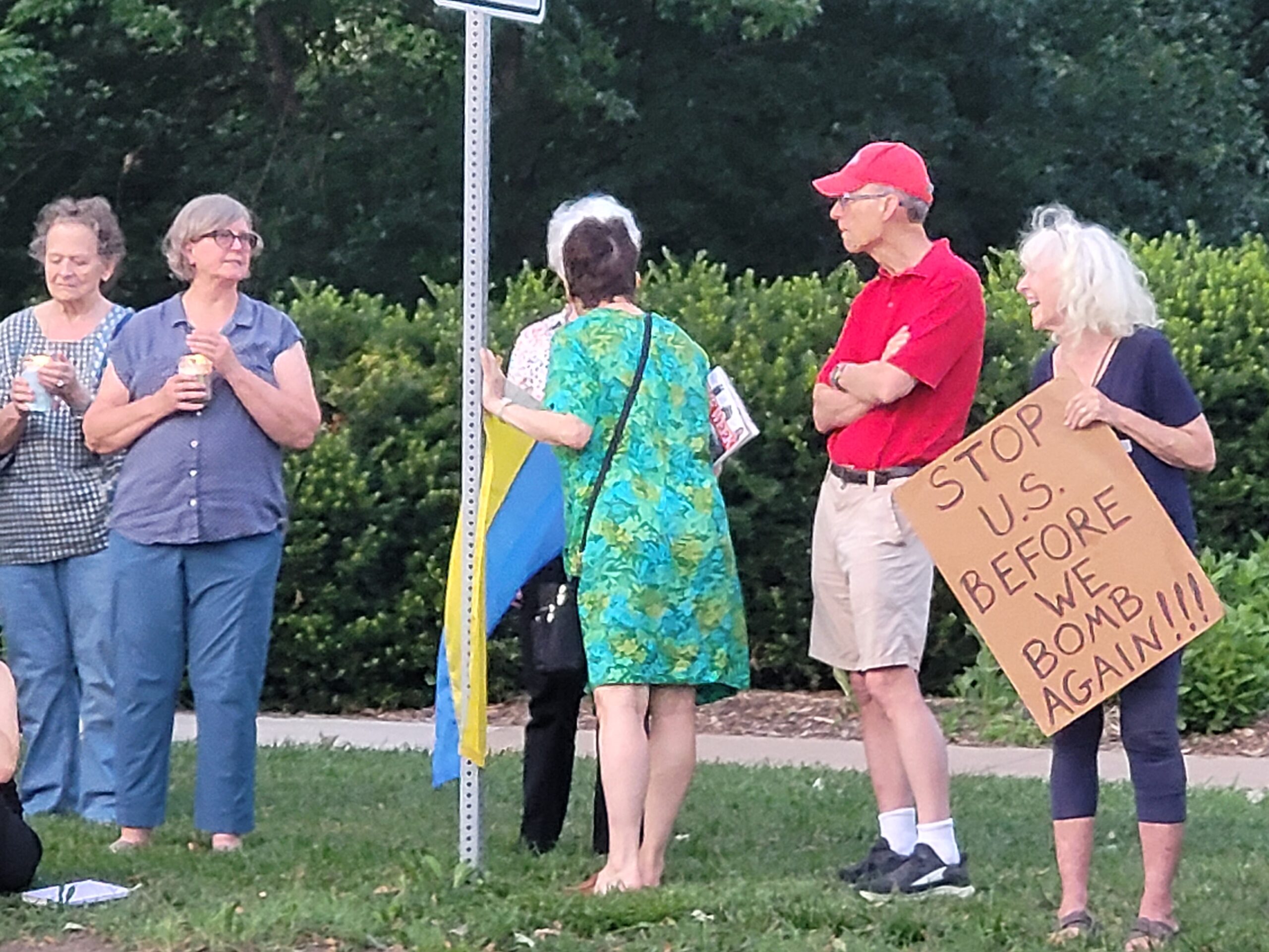 PHOTOS: Protesters hold candlelight vigil after U.S. drops bombs in ...